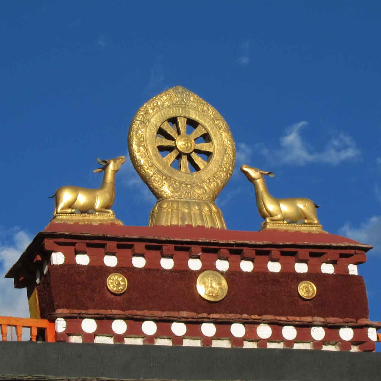 Deer symbol usually includes two parts that are deer and dharma wheel